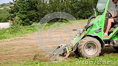 Mini Skid Steer Loader Clear the Construction Site. Land Work. Small ...