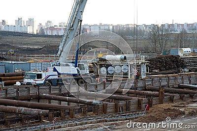 Mobile Auto Cranes Working At Construction Site. Digging A Pit For The ...