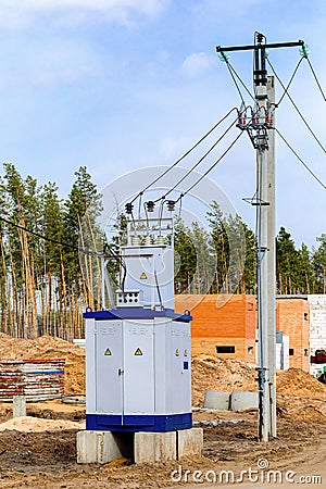 A Mobile Live Transformer Booth Stands Near High Voltage Poles On A ...