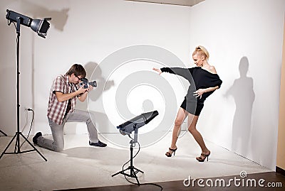 Model Poses For Photographer In Photo Studio Royalty Free Stock Photo ...