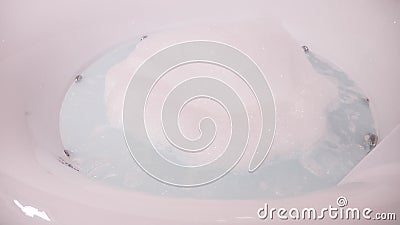 A Modern Round Bath With A Jacuzzi, Filled With Bubbling Water With ...