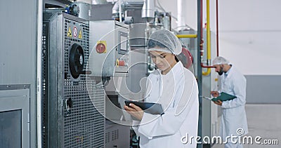 In the Morning Two Beautiful Engineers in Manufacturing Industry Check ...