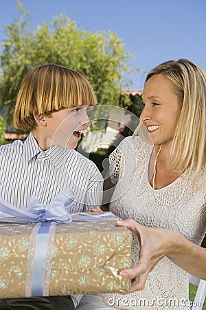 Mother Gifting A Present On Birthday - Stock Image - Everypixel