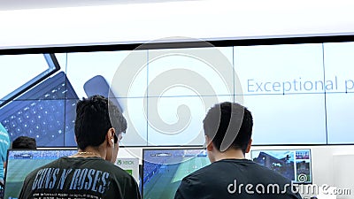 Motion Of People Playing Xbox Game At Microsoft Store Stock Footage ...