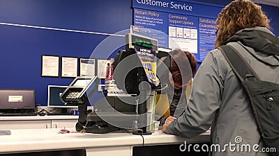 Motion of People Returning Items at Customer Service Counter Stock ...