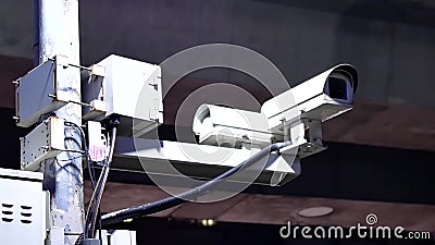 Motion of Security Cameras and Traffic Light on Street at Night Stock ...