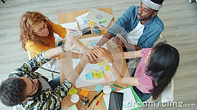 Multi-racial Group Making Collage in Office Working at Project Enjoying ...