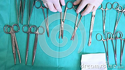 Multiple Surgery Instruments on Blue Table Above View. Surgeon Take ...