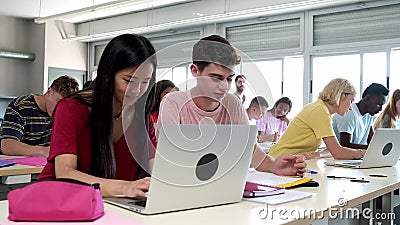 Multiracial High School Students in Class Using Laptops, Doing Homework ...