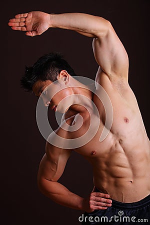 Muscle Man Stretching Left Arm And Abs Stock Image - Image: 27543501