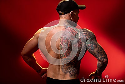 Muscular And Huge Back With Typical Bodybuilding Pose. Bodybuilder With ...