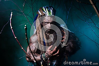 Muscular Werewolf With Dreadlocks With Long Nails Among The Bran ...
