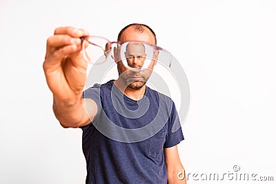 Myopia In Mature Men Is Corrected With Glasses, A Young Man Holds ...