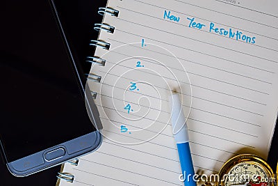 New Year Resolutions Text List with Alarm Clock, Marker and Eyeglasses ...