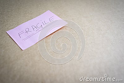 Note `fragile` On A Pink Sticker On A Cardboard Surface. Royalty-Free ...