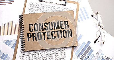 Notepad With Text CONSUMER PROTECTION On A Charts And Numbers. Business ...