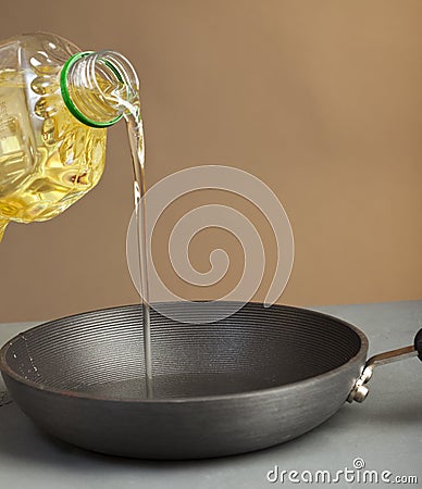 Oil Being Poured Into A Non-stick Pan For Cooking Royalty Free Stock ...