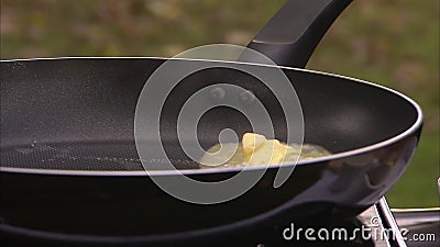 An oil on a frying pan stock footage. Video of warm - 113690390