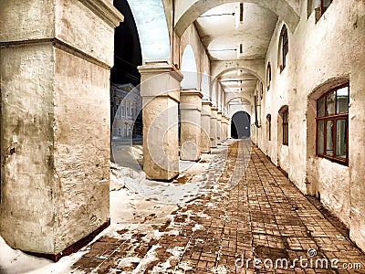 Old Ancient Colonnade Pathway At Night. Dimly Lit Corridor With Arches ...