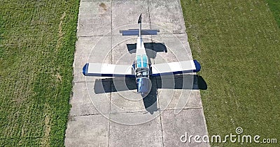An Old Corn Plane is Standing in a Field on the Runway, the Camera ...