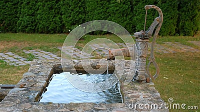 An Old Cast Iron Hand Pump Water Column is Equipped for a Decorative ...