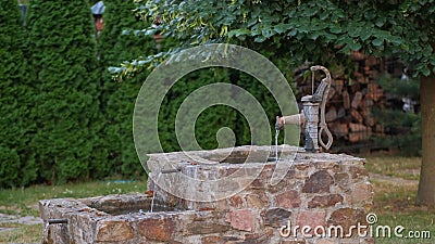An Old Cast Iron Hand Pump Water Column is Equipped for a Decorative ...