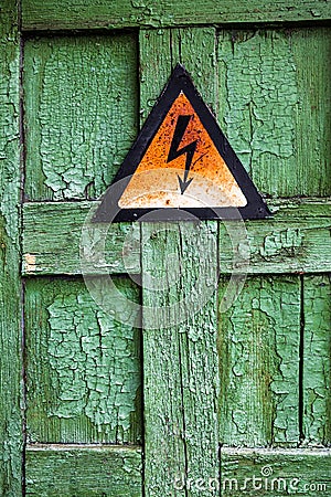 Old Rusty Warning High Voltage Sign On Cracked Wooden Surface Royalty ...