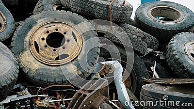 Old Rusty Wheels of Different Vehicles are Dumped in a Heap in a ...