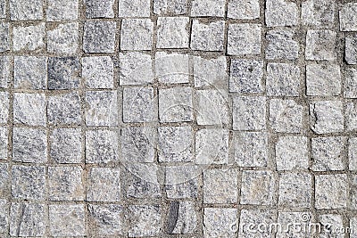 An Old Stoneblock Pavement Cobbled With Square Granite Blocks As A ...