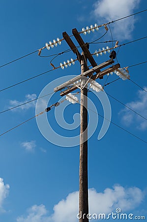 Old Wooden Three-phase Electric Utility Pole With Blue Sky In ...