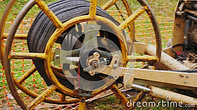 Old Yellow Bobbin with Wire and Turning Chain on Green Grass Stock ...