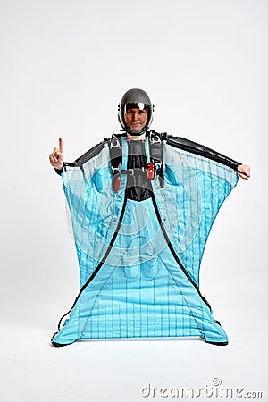One Finger. Men In Wing Suit Show One Finger. Skydiving Men In ...