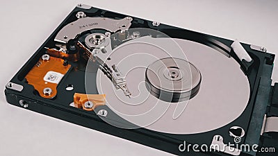 Opened Hard Disk Drive with Spinning Platter. Move of Writing Magnetic ...
