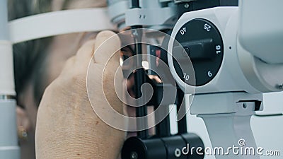 Eyesight Check-up Device is Being Managed by a Doctor. Ophtolmologist ...