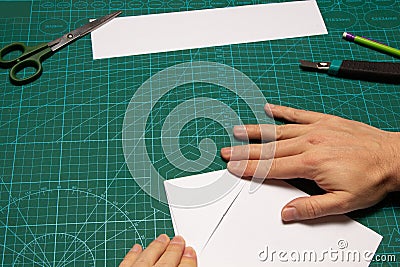 Origami Project On White Paper With Cutter And Scissors Stock Image ...