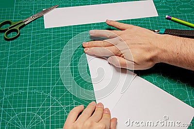 Origami Project On White Paper With Cutter And Scissors Stock Image ...