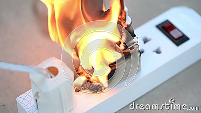 Overloaded Outlet with an Extension and Many Sockets Plugged in, a Hand ...