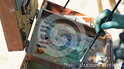 Paint mixing board stock footage. Video of mixing, colored - 55797346