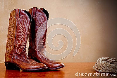 A Pair Of Brown Cowboy Boots And A Coil Of Rope Royalty-Free Stock ...