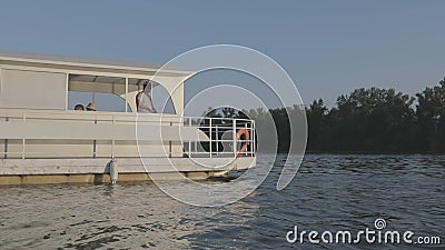 Party Boat at Sunset. Party Boat Floats on the River at Sunset ...