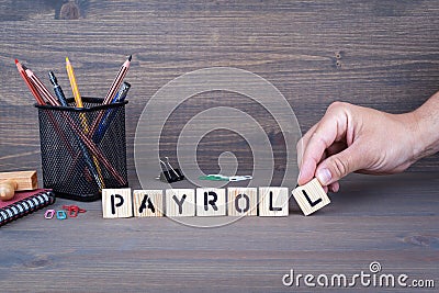 Payroll. Wooden Letters On Dark Background Royalty-Free Stock ...