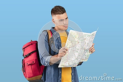 Pensive Young Backpacker Looking At Map With Concern, Feeling Lost ...