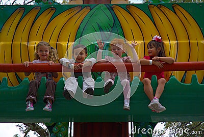 People-Children On A Amusement Park Ride With Happy Faces Editorial ...