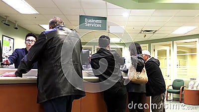 People at Counter Talking To the Teller Stock Footage - Video of female ...