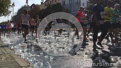 People Running at Berlin Marathon Over Tons of Empty Plastic Cups Stock ...
