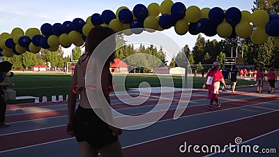 People Walking on Stadium Race Track Stock Footage - Video of balloon ...