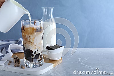 Person Preparing Bubble Milk Tea With Tapioca Balls At Grey Marble ...