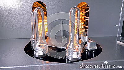 PET Preforms Move on Heating Oven Line in Fast Speed. Plastic Bottles ...