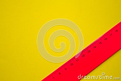 Pink Ruler On Yellow Background Stock Image | CartoonDealer.com #222404893