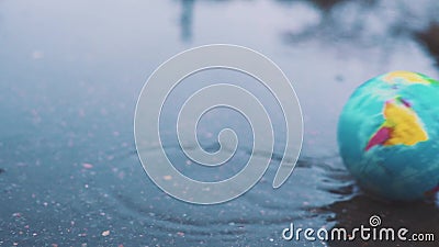 Planet Earth Beautiful Falls into a Muddy Puddle. Concept on ...